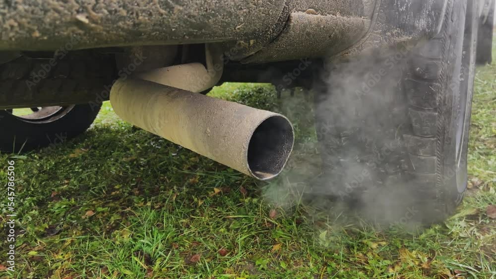 Smoke emissions from Car exhaust pipe, clog air pollution. Toxic fumes ...