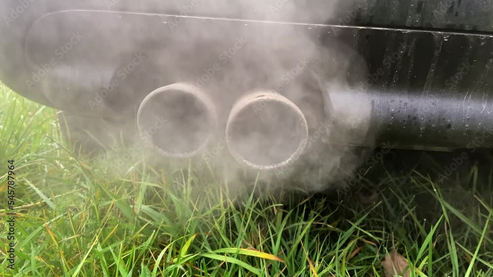 Smoke emissions from Car exhaust pipe, clog air pollution. Toxic fumes ...