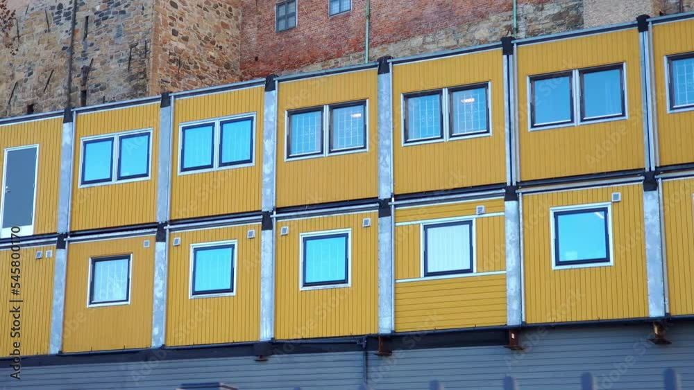 Container homes and offices on a construction site - yellow shipping ...