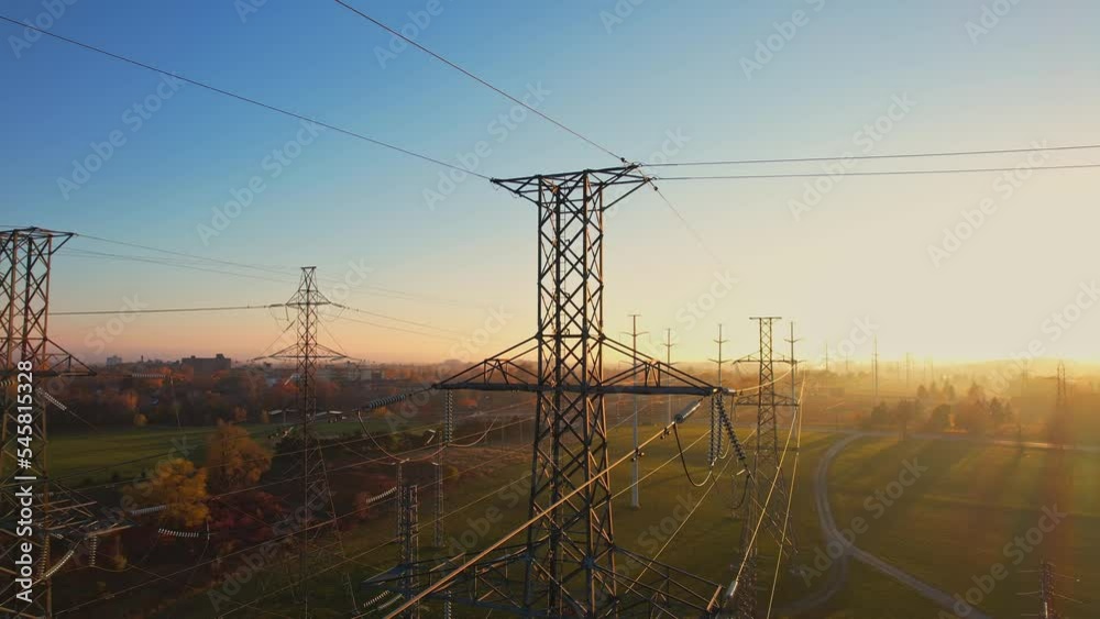 Transmission power tower with wires at golden hour. Electricity pylon ...