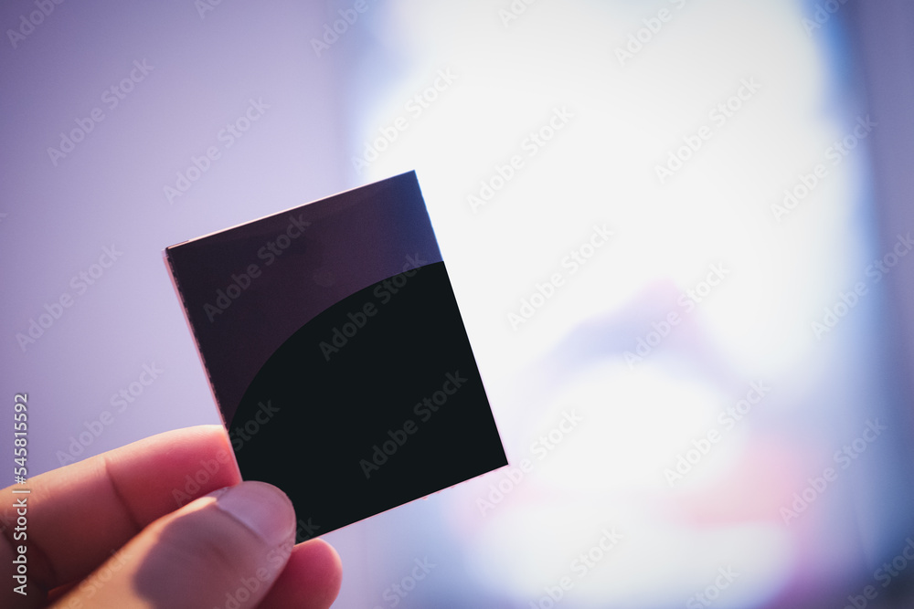 A hand holding a paper movie ticket. Blank template of ticket that you ...