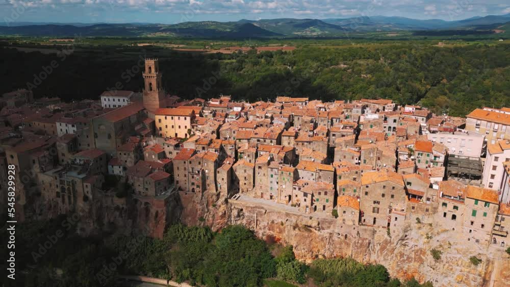 Flying around famous Tuscany town Pitigliano, built on Etruscan tufa ...