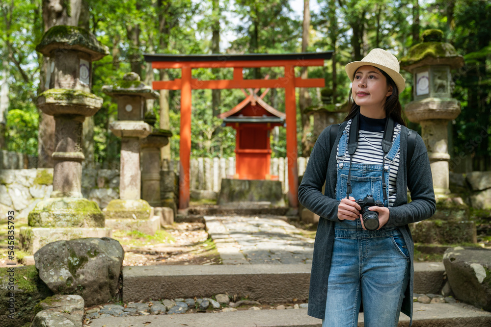 Asian Taiwanese woman photographer enjoying natural beauty and historic ...