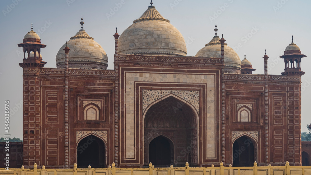 The ancient red sandstone mosque of the Taj Mahal complex. Decorated ...