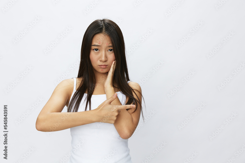 Asian woman hand signals, finger pointing facial skin problems, acne ...