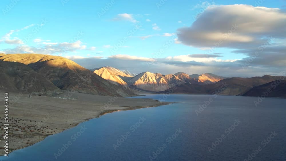 Aerial video of Pangong Lake and mountains with clear blue sky, it's a ...