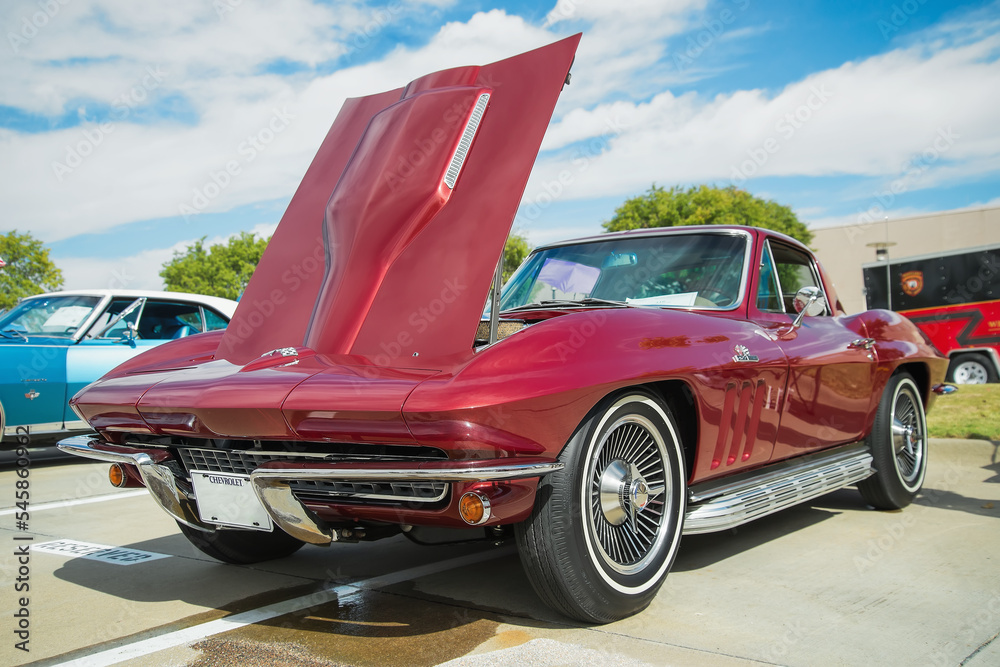 Front side view of a red 1966 Chevrolet Corvette 427 classic car., in ...