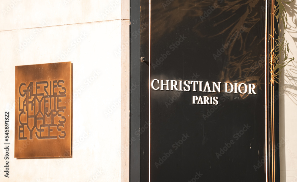 The logo sign of Christian Dior French luxury clothing company on top ...