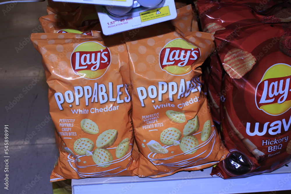 Lays white cheddar potato bites shot closeup on a shelf, Stock Photo ...
