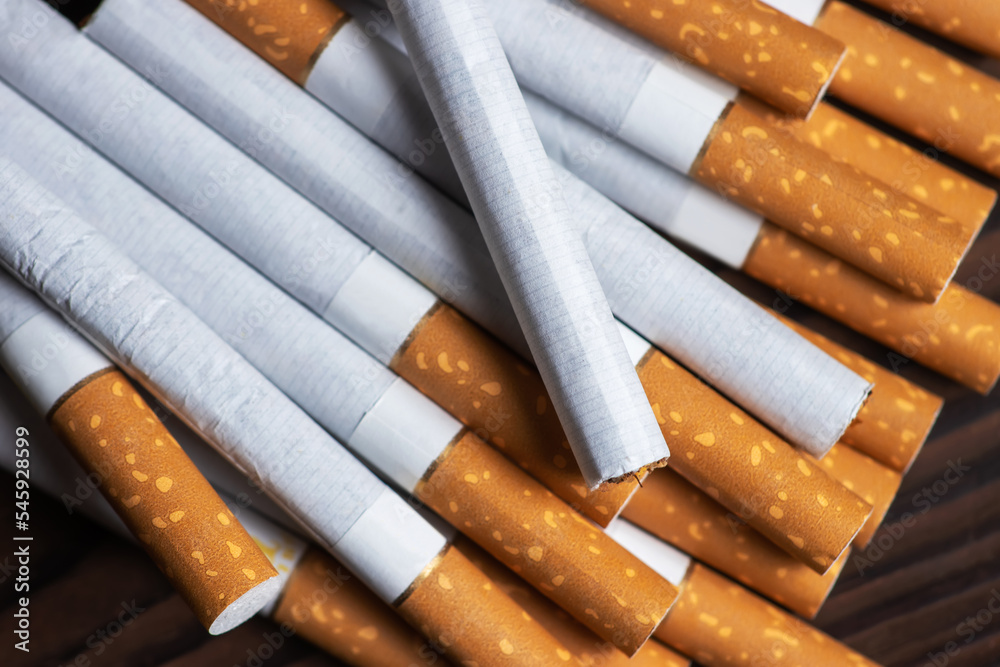 Many cigarettes stacked together. Drugs are harmful to the respiratory ...