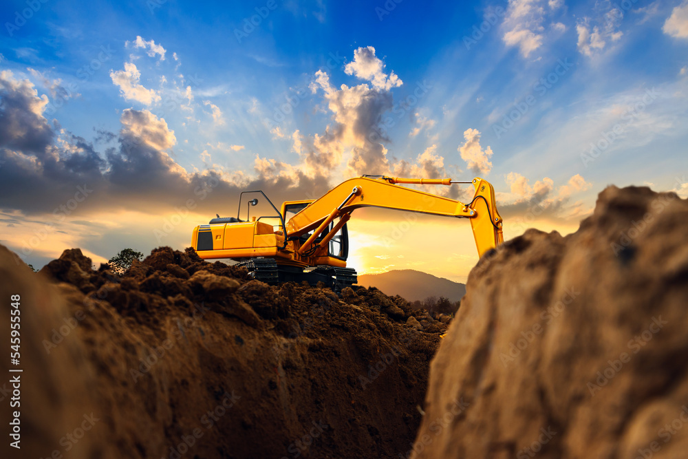 Crawler excavator are digging soil in the construction site on the blue ...