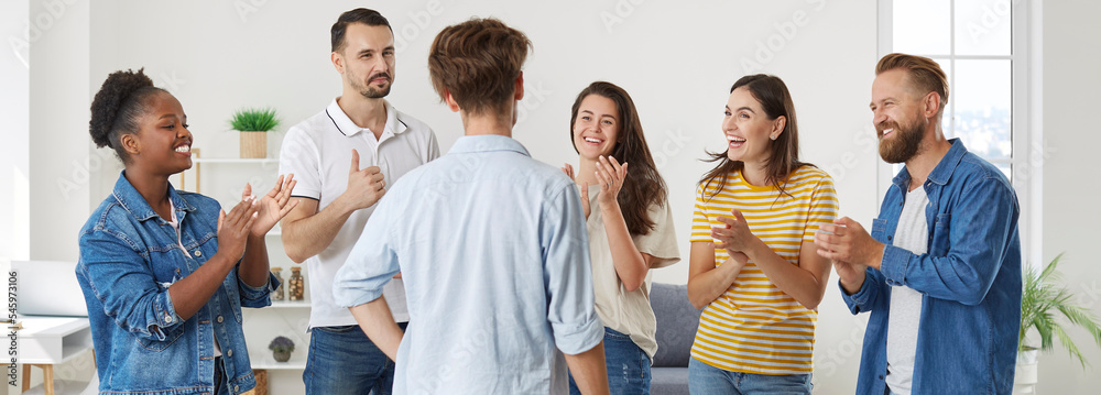 Congratulations. Group of friends applauding young man. Happy people ...
