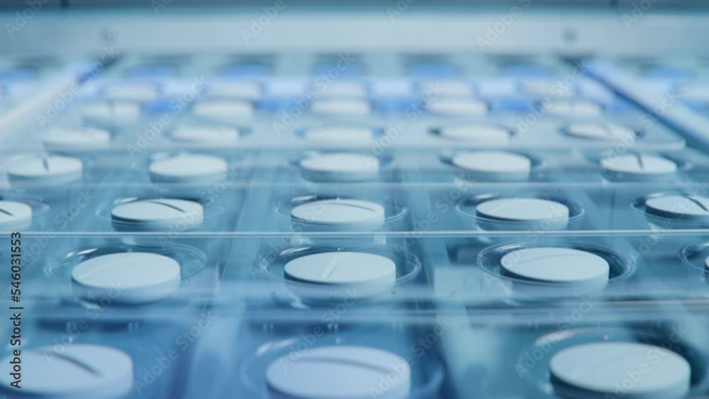 Close-up Shot of White Pills During Production and Packing Process on ...
