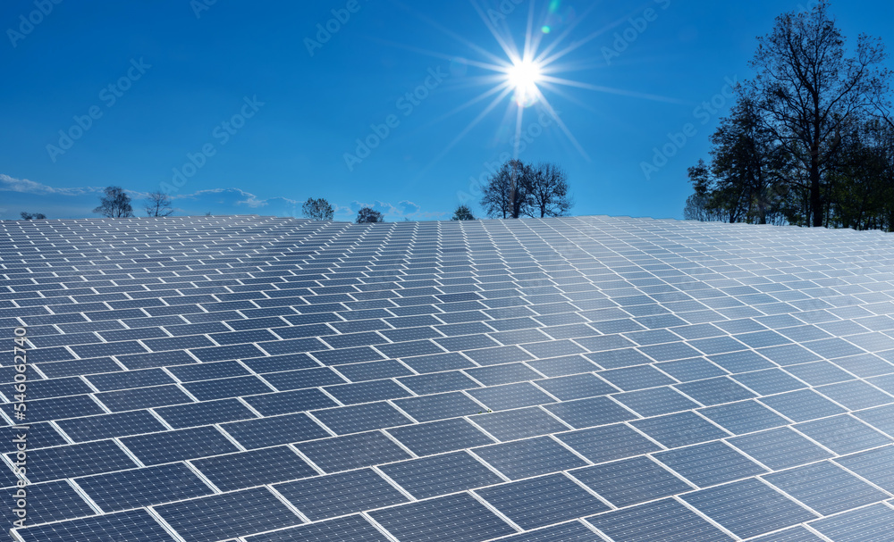 Vast surface of Solar Panels on blue sky with sun shining, Photovoltaic ...