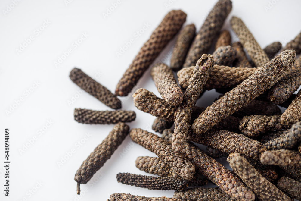 dried aromatic pippali long pepper on a white background Stock Photo ...