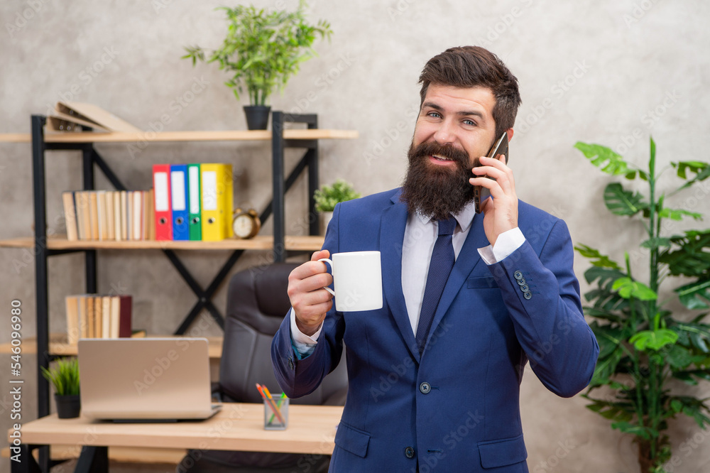Thank you for calling. Happy man talking on phone drinking tea. Phone ...