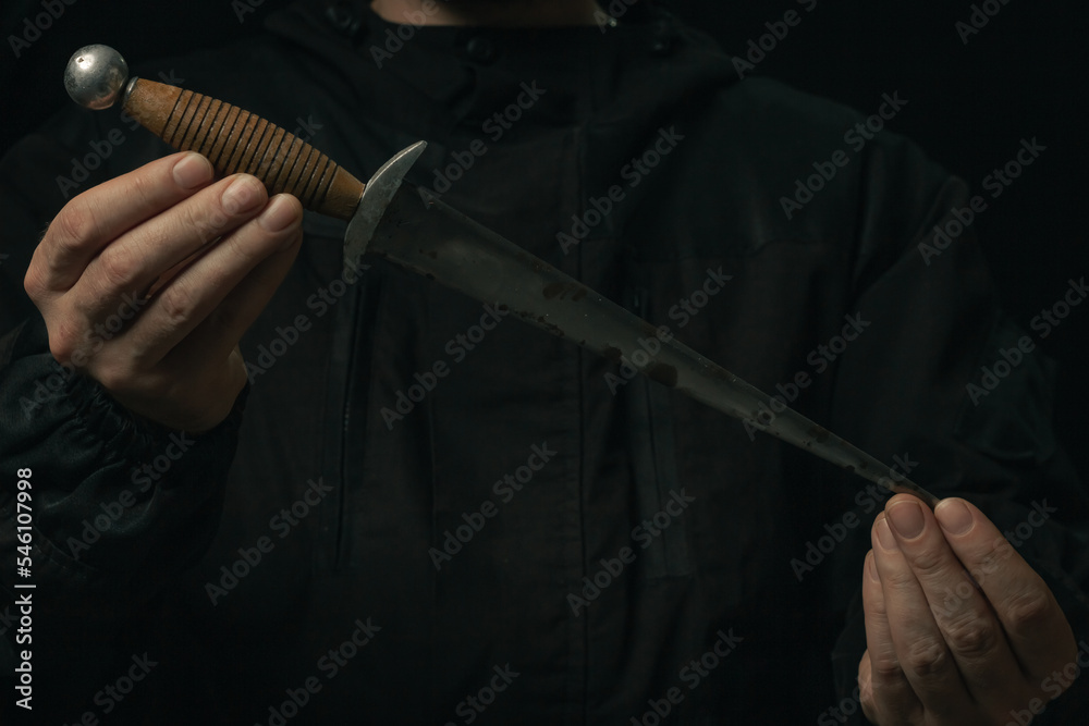 hand holding medieval antique dagger knife Stock Photo | Adobe Stock