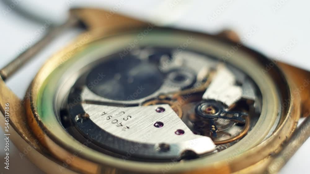 Mechanism of an old mechanical wrist watch chronometer in motion close ...