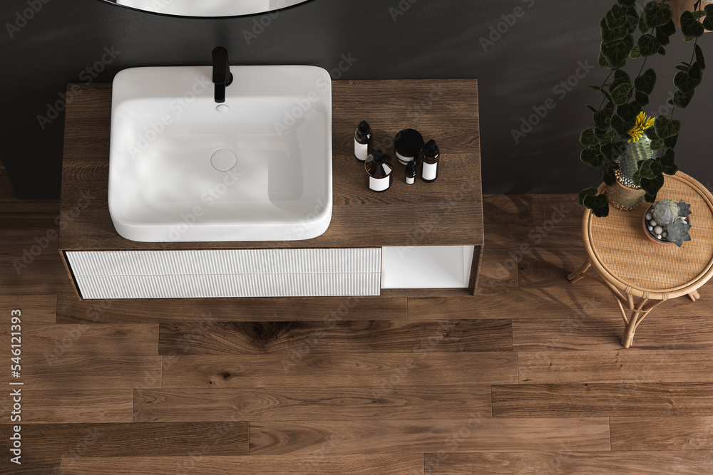 Top view an wooden vanity counter with white ceramic washbasin and ...