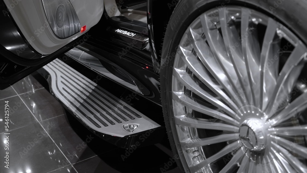 Closing door and automatic folding passenger footrest for passenger to ...