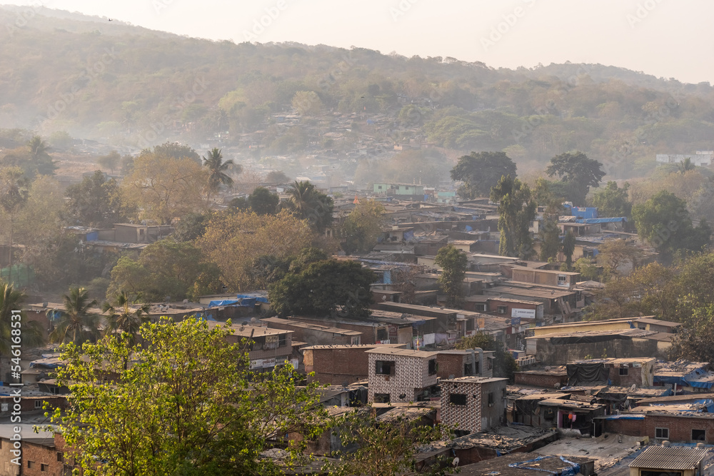 Slums clustered on a hillside on the outskirts of the Borivali National ...