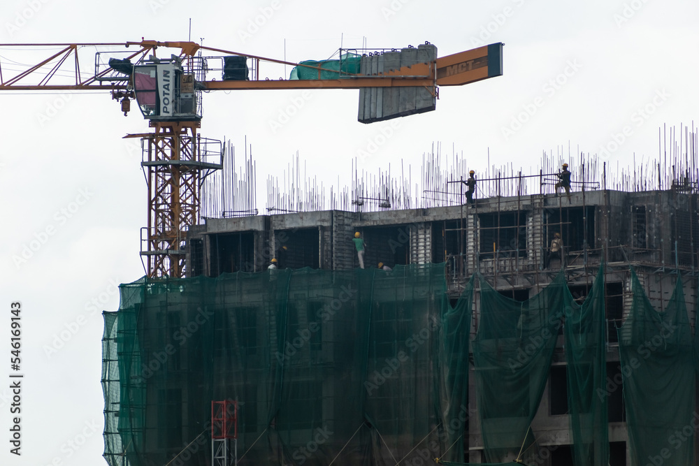 Safety nets and scaffolding on a tall high rise building under ...