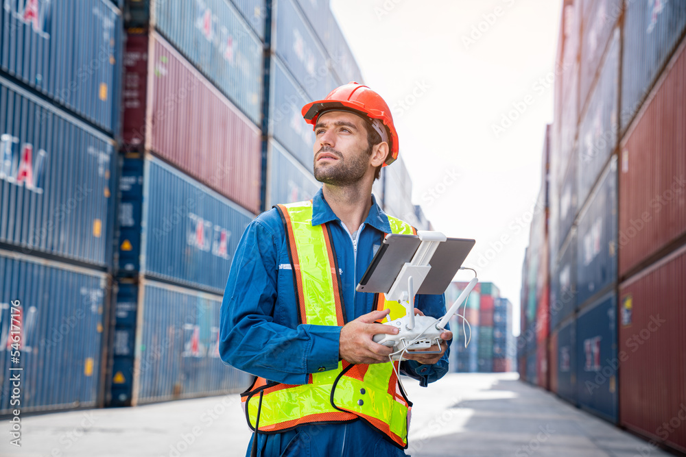 Male Container yard worker using tablet for control loading Containers ...