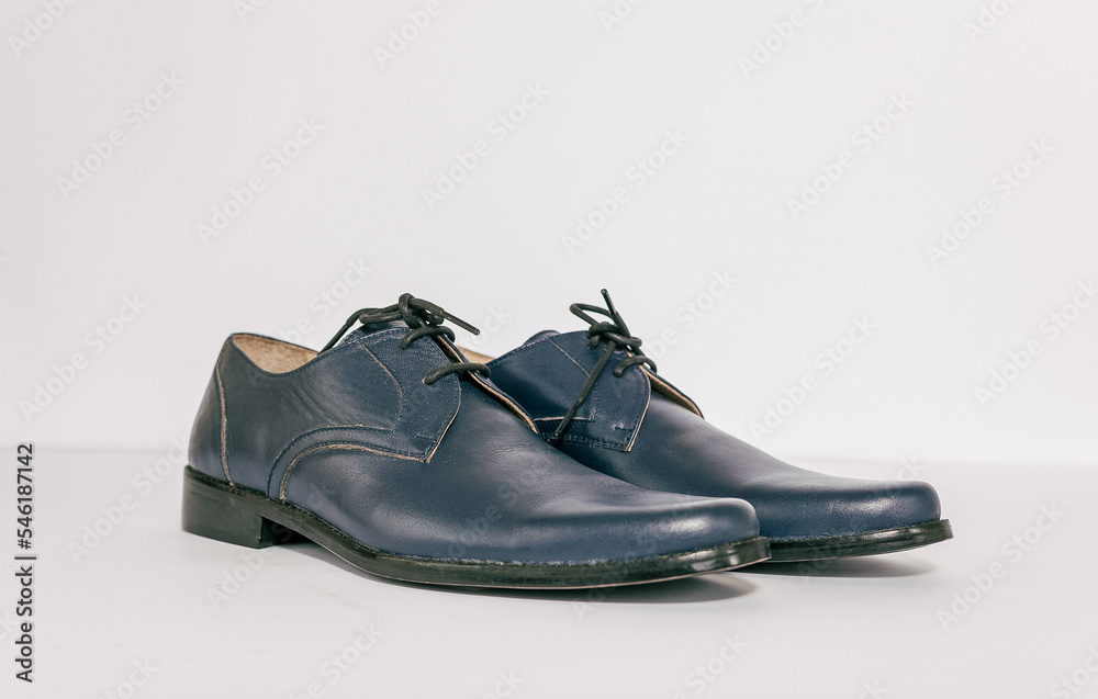 Blue men shoes on the white background. Eye level look and able to ...