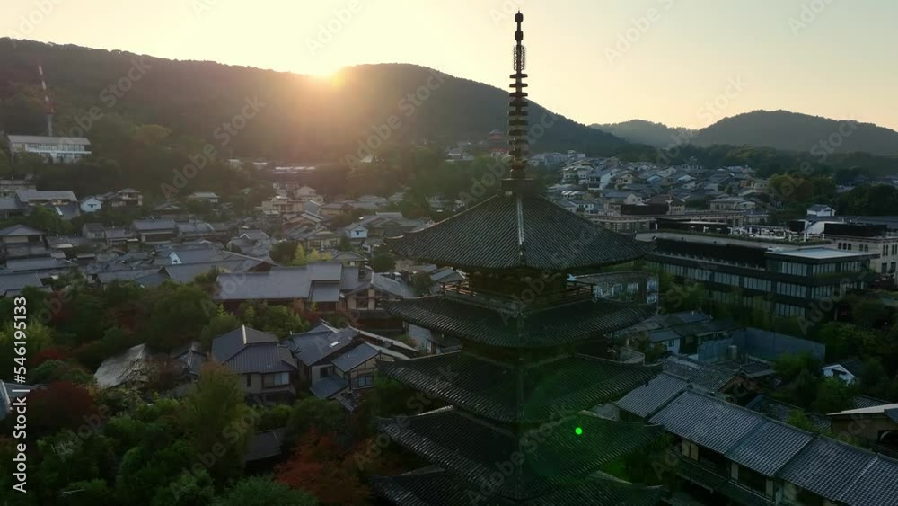 Kyoto aerial view at sunrise with historic Yasaka pagoda, flying above ...