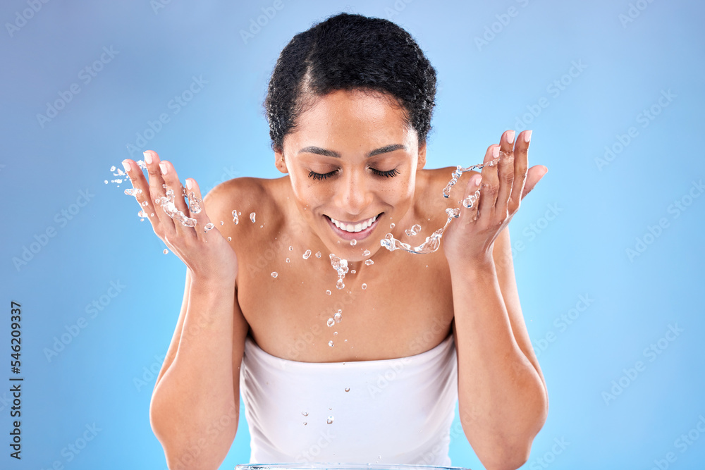 Black woman, cleaning face with water, skincare and wellness with smile against a mockup studio ...