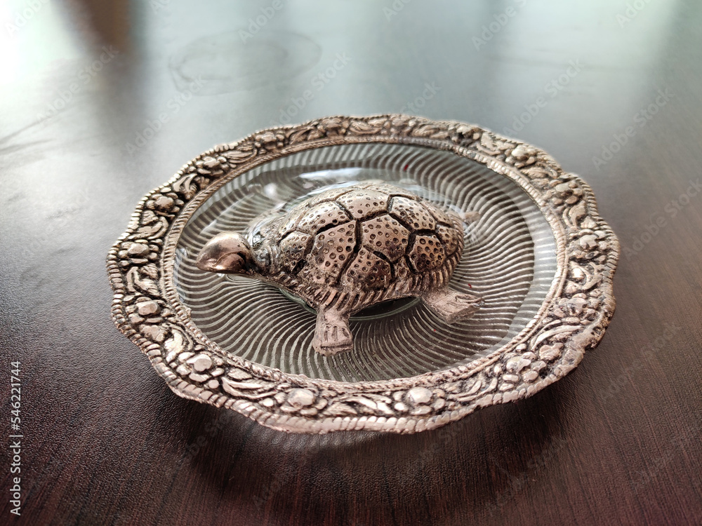 A silver tortoise in a silver plate is a symbol of good luck, wisdom ...