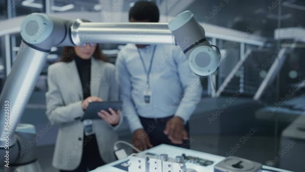 Dynamic Close Up Follow Footage of a Modern Robotic Arm Picking Up and ...