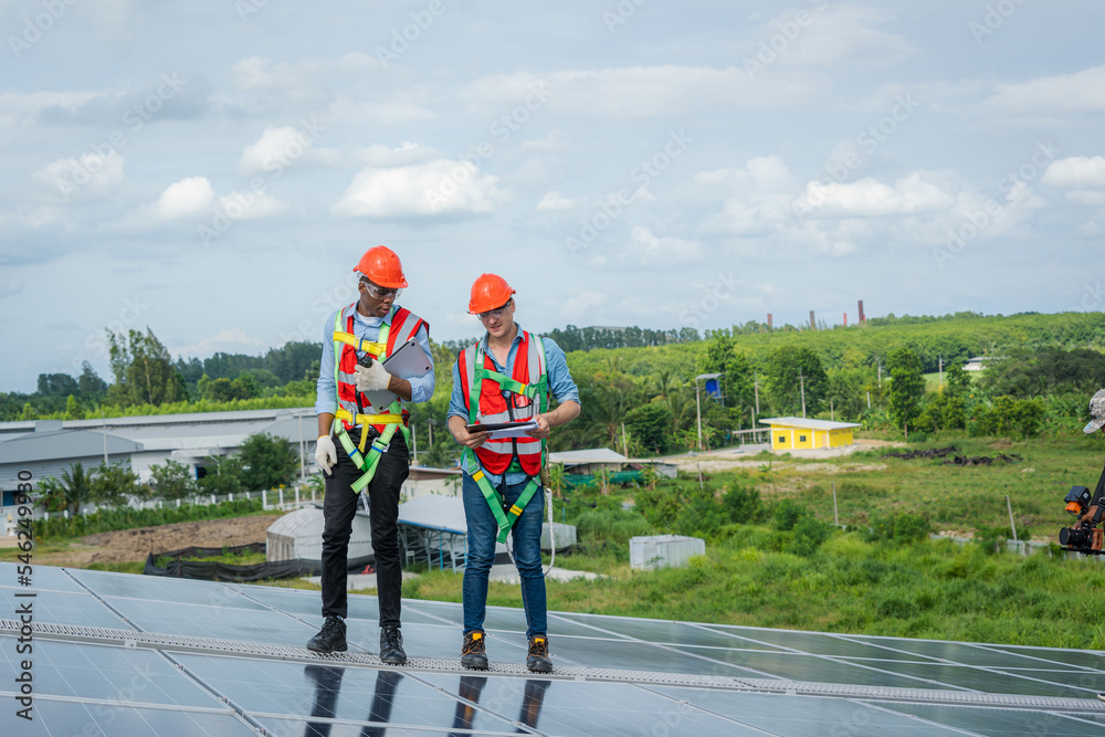 Technician wearing safety harness belt during installing the solar ...