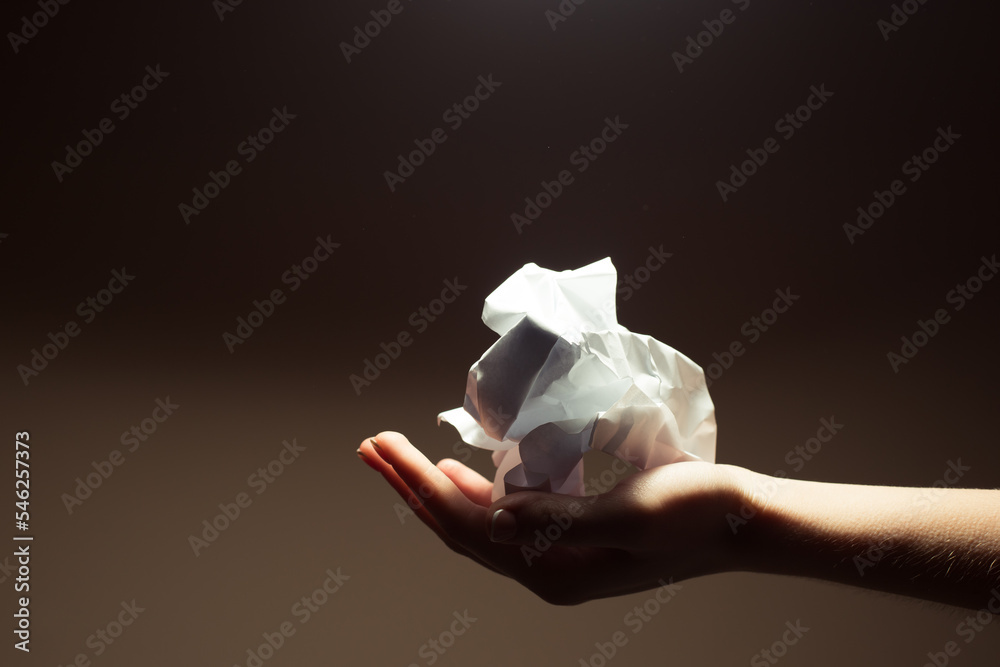 crumpled sheet of paper in hand Stock Photo | Adobe Stock