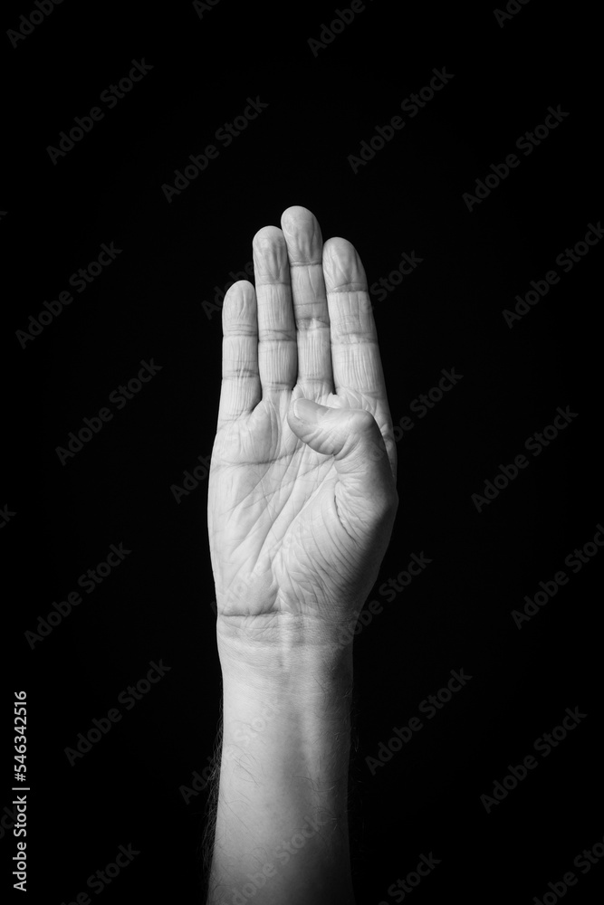 Hand demonstrating the Arabic sign language letter 'ك' or 'Kaf' Stock ...