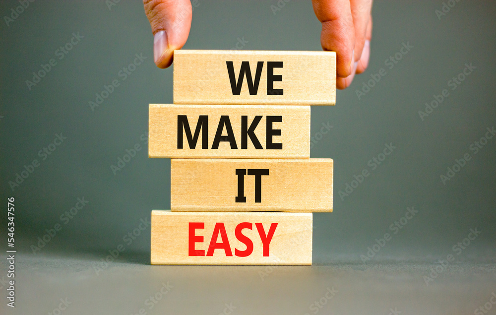 We make it easy symbol. Concept words We make it easy on wooden cubes ...