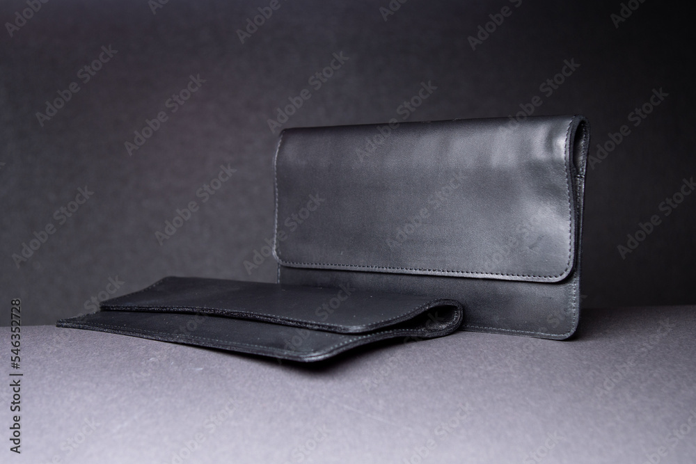 Black leather vertical wallets for men with smooth glossy texture on ...