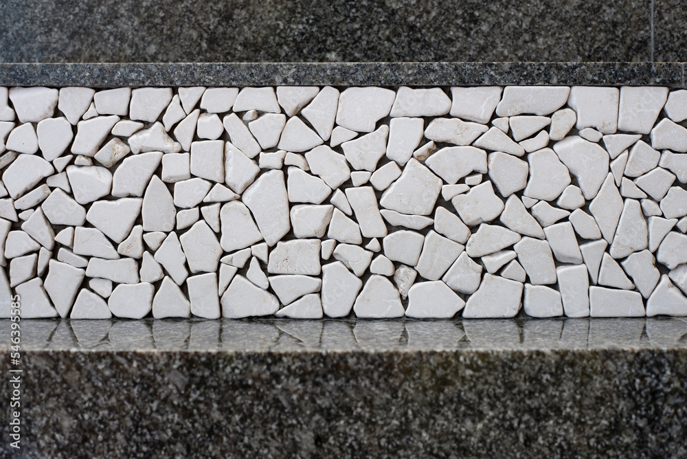 Photo Granite stairs of dark granite with inlays of white pebbles ...