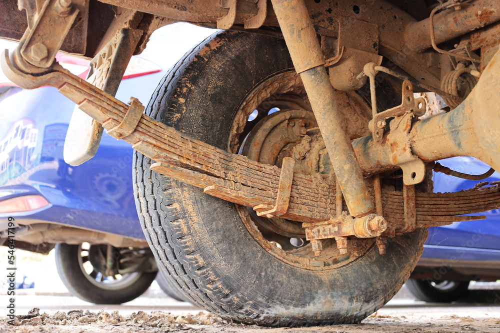 Old leaf springs stuck in car. Closeup leaf springs of dirty and rusty ...
