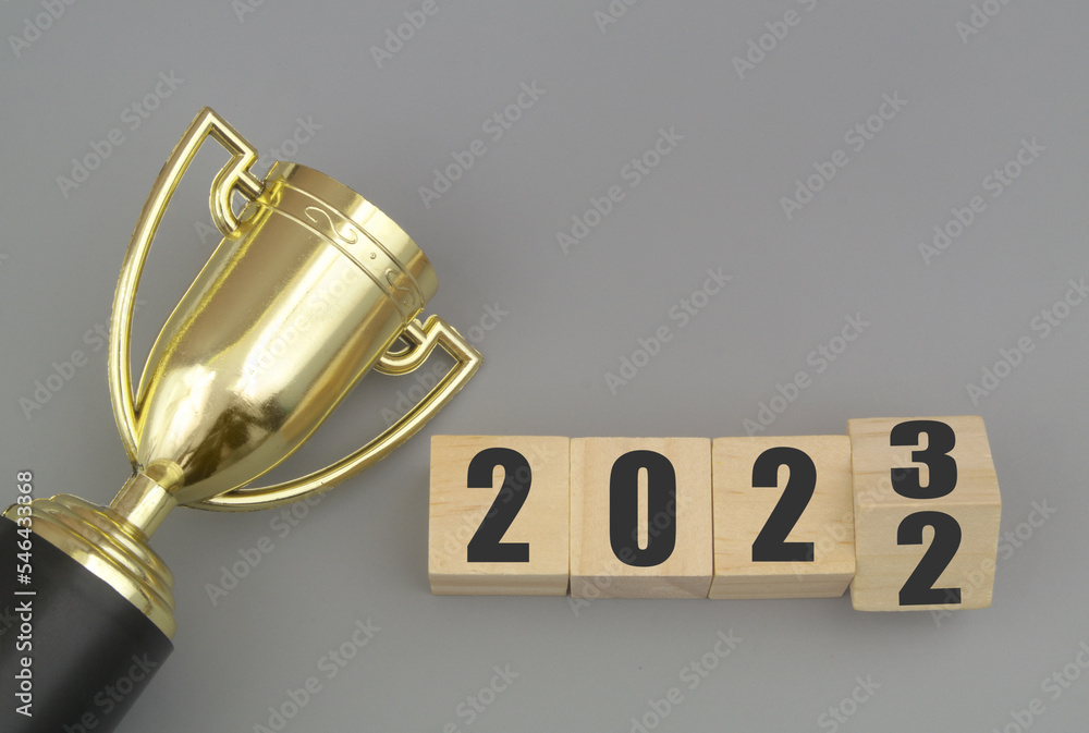 Gold trophy champion cup and flipping numbers 2022 and 2023. Sport ...