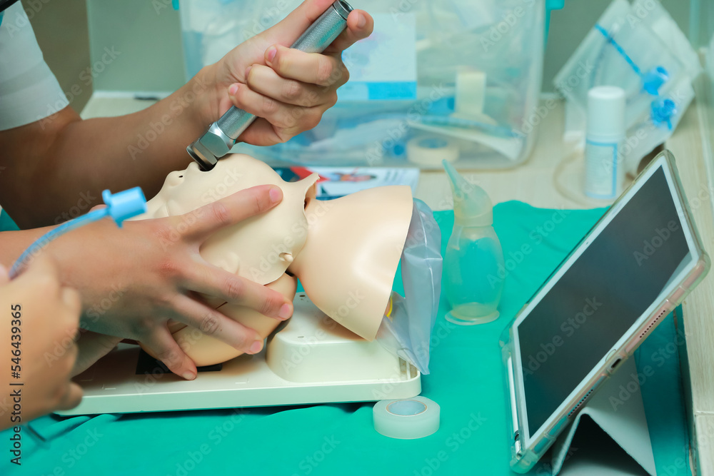 Anesthesiologist performing an orotracheal intubation on a simulation ...