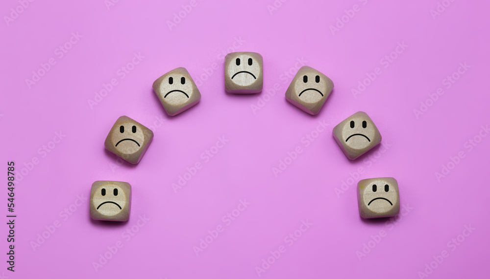 Big sad-shaped block cubes on pink background, sad face, sad face ...