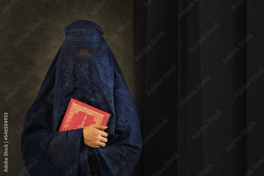 Asian women with burka reading the Islamic Quran Stock Photo | Adobe Stock