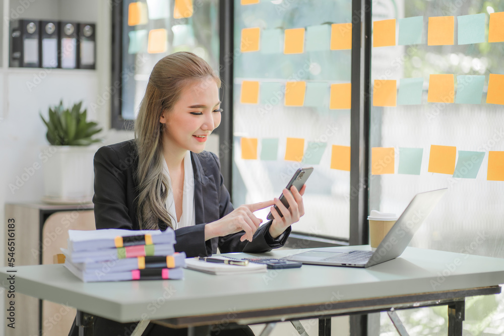 business woman or accountant who are using a calculator to calculate ...