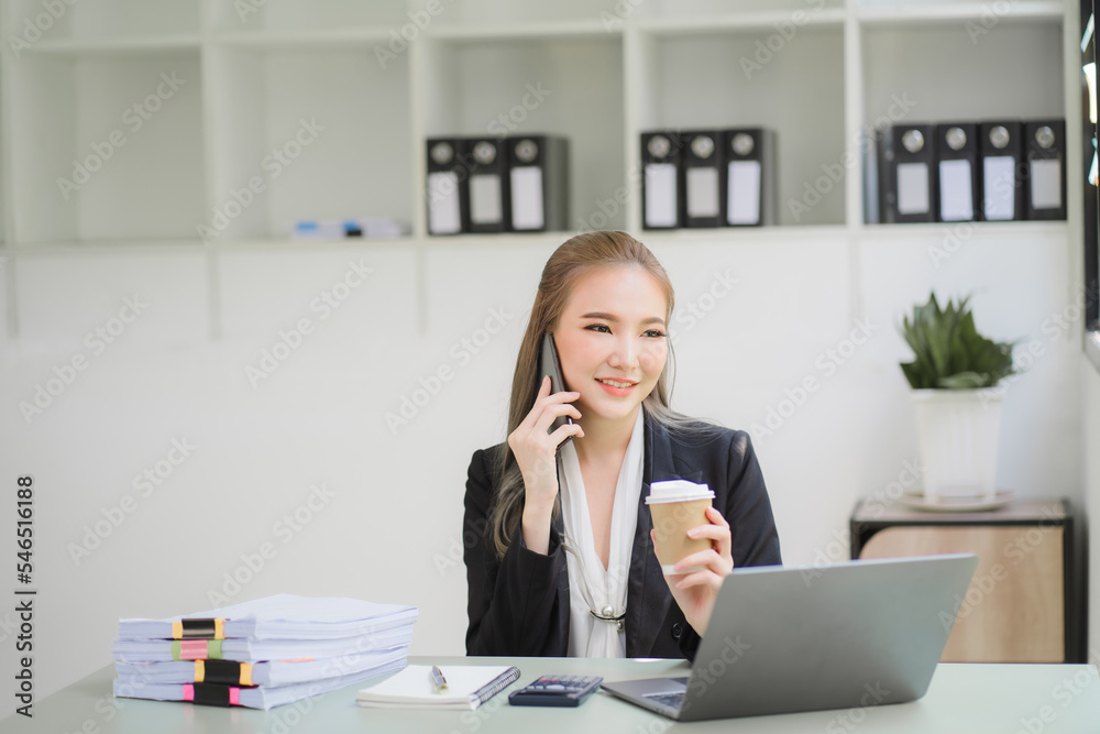 business woman or accountant who are using a calculator to calculate ...