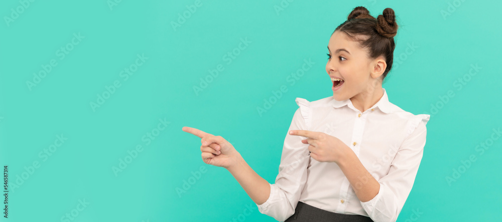 Exclusive. Happy schoolchild point fingers. Pointing gesture. Pointing ...