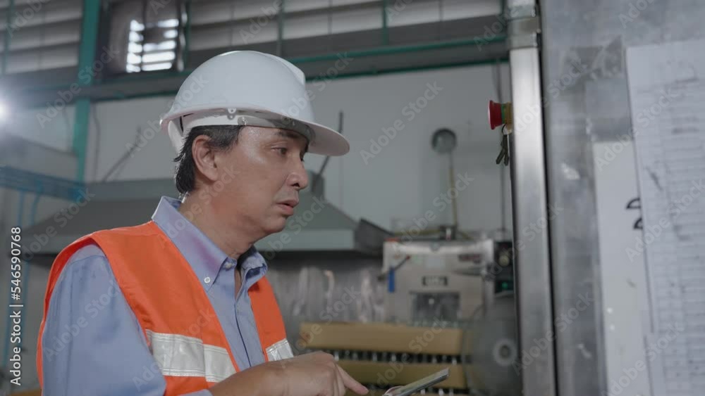 Machine or maintenance engineers inspect machines and sterilizers in ...