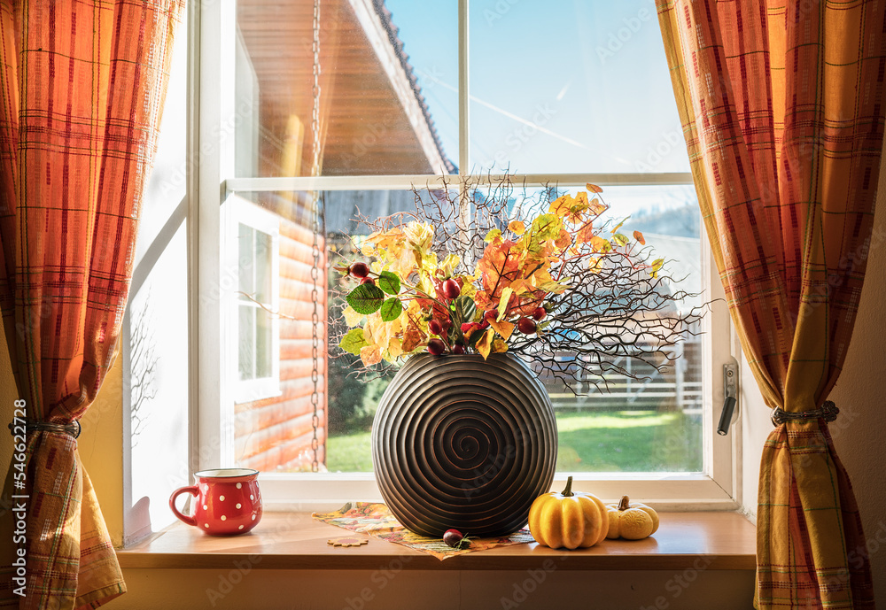 Sunny day in the countryside home. Dried trees branches with yellow and ...