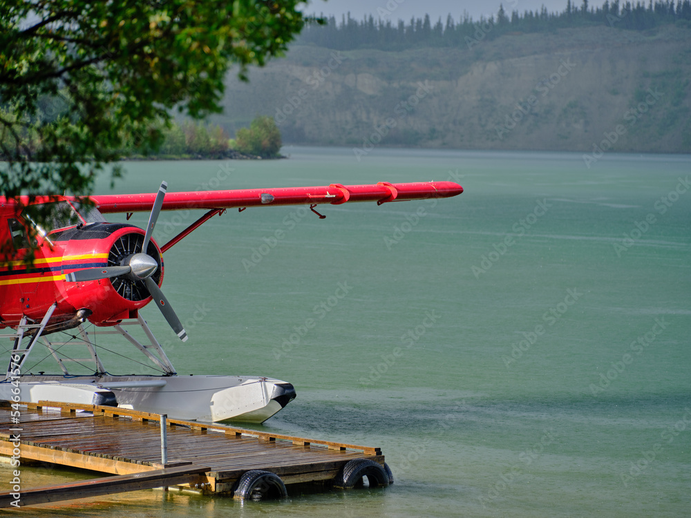 Red seaplane float plane after a thunderstorm in the town of Whitehorse ...