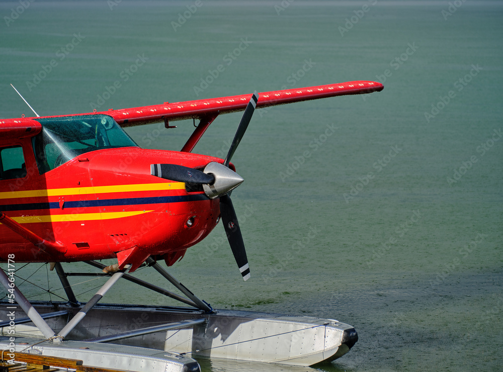Red seaplane float plane after a thunderstorm in the town of Whitehorse ...